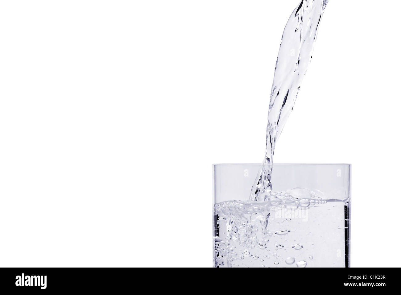 Fresh water being poured into glass isolated on white background Stock Photo - Alamy