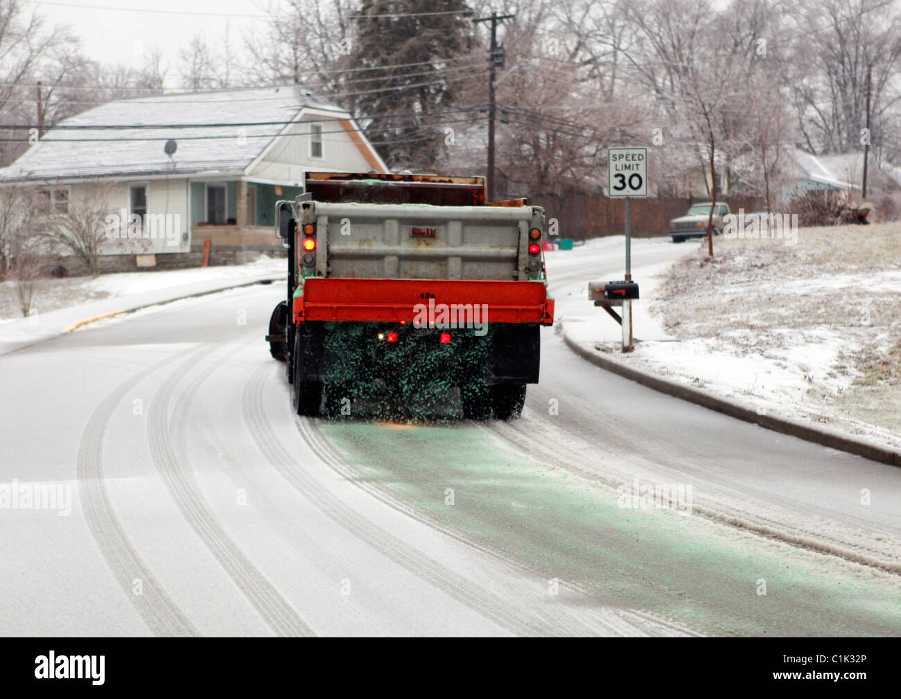 A city plow truck spreads salt. Scenes during the 2011 ice storm Stock ...