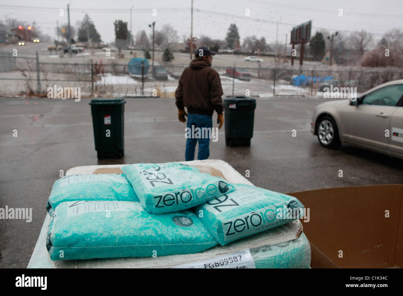 A worker at Kleindorfer's Hardware watches and listens to falling ice ...