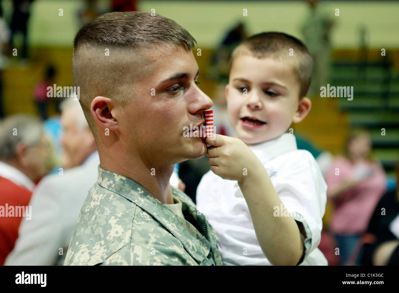 Andrew Gober holds his son Jakob Gober during a ceremony for the ...