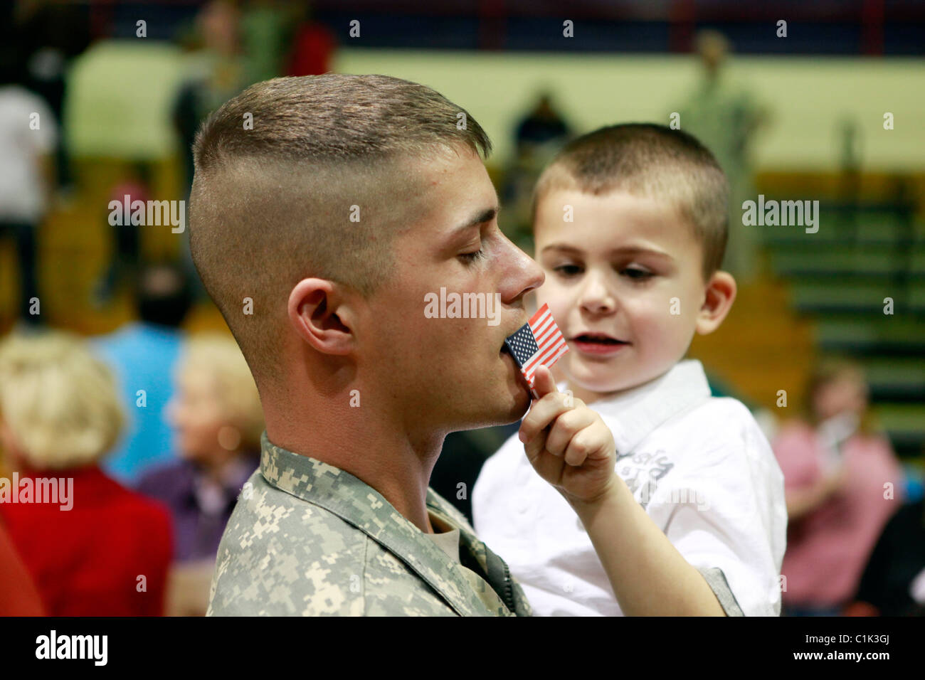 Andrew Gober holds his son Jakob Gober during a ceremony for the ...
