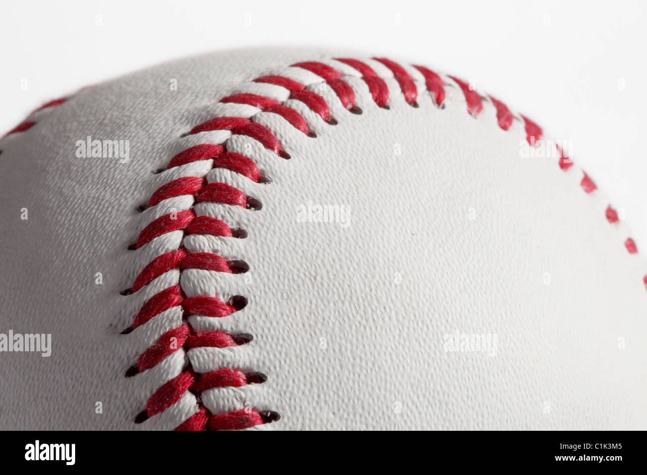 A close up of a baseball with red stitching Stock Photo - Alamy