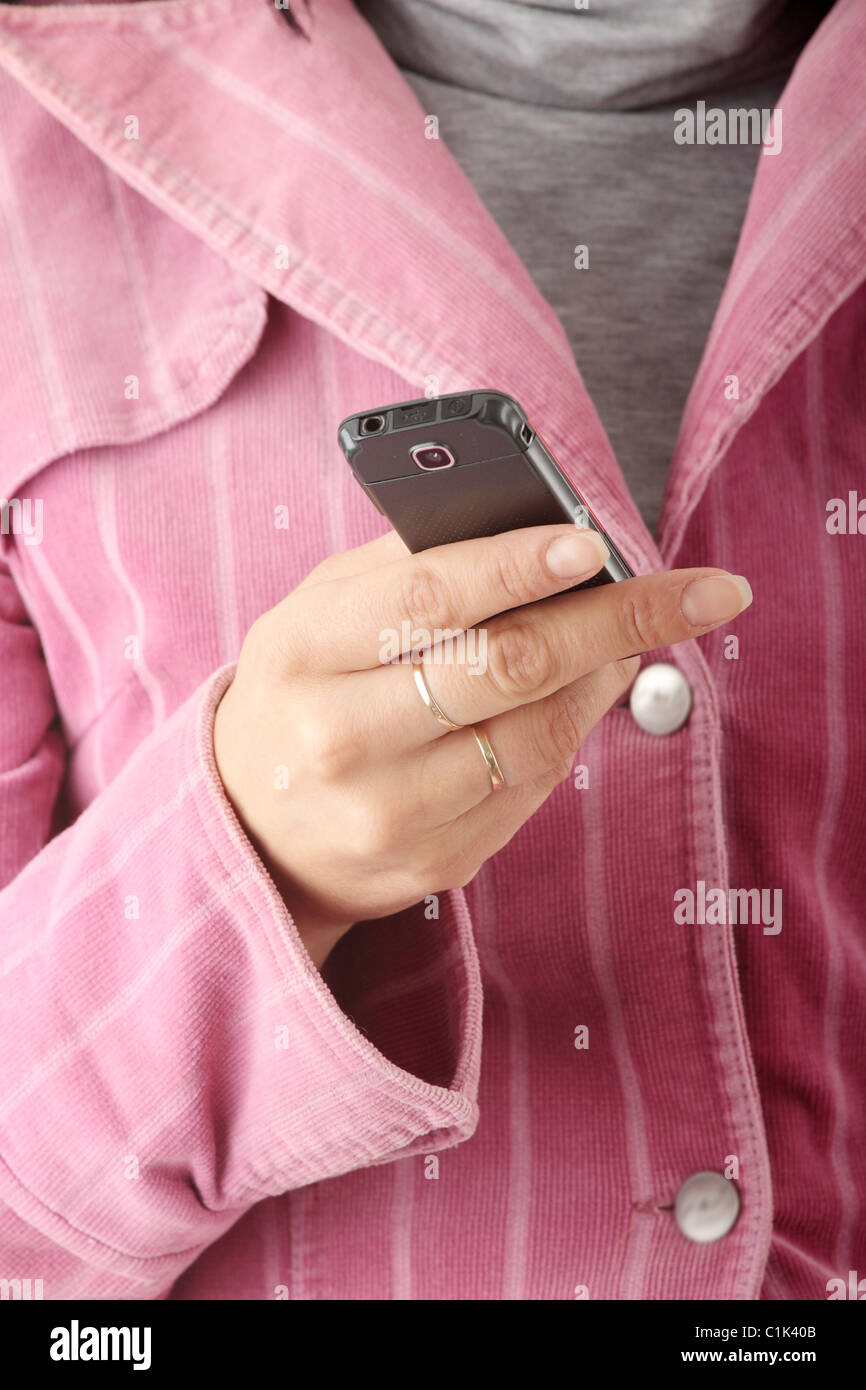 Typing sms on mobilephone, isolated Stock Photo - Alamy