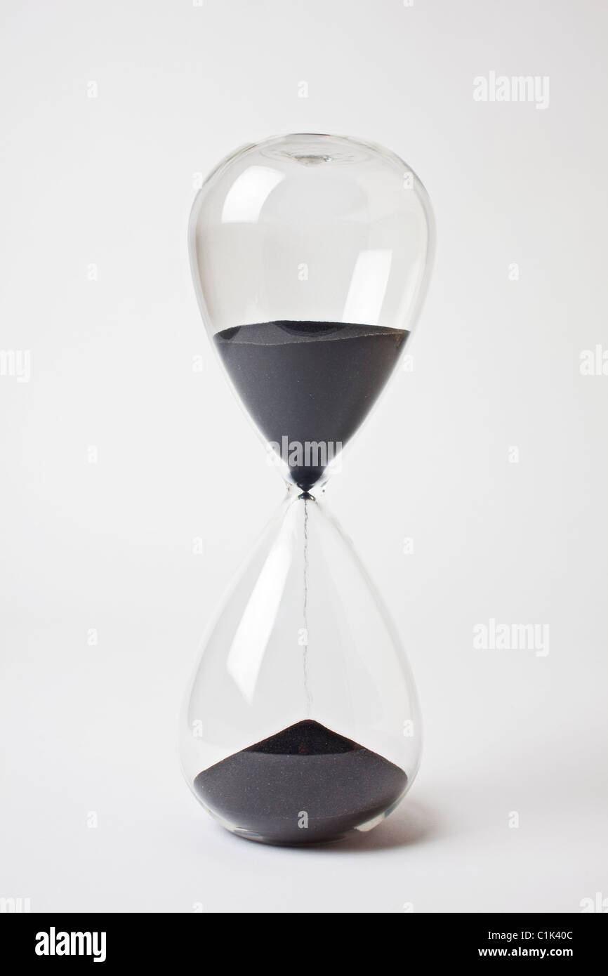 Hourglass black sand timer Stock Photo - Alamy