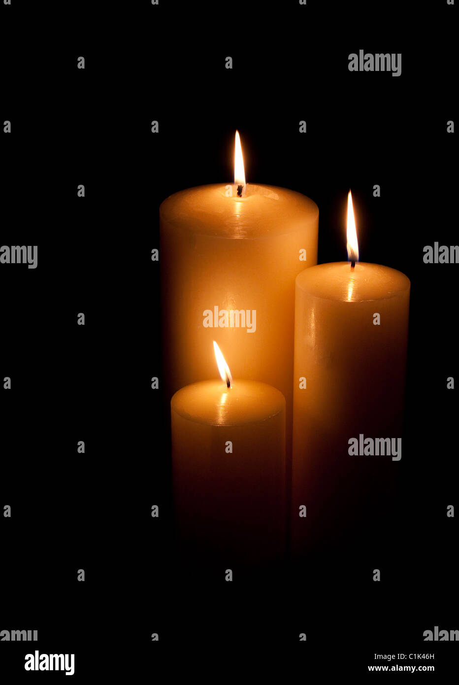 Three Candles Burning Stock Photo - Alamy