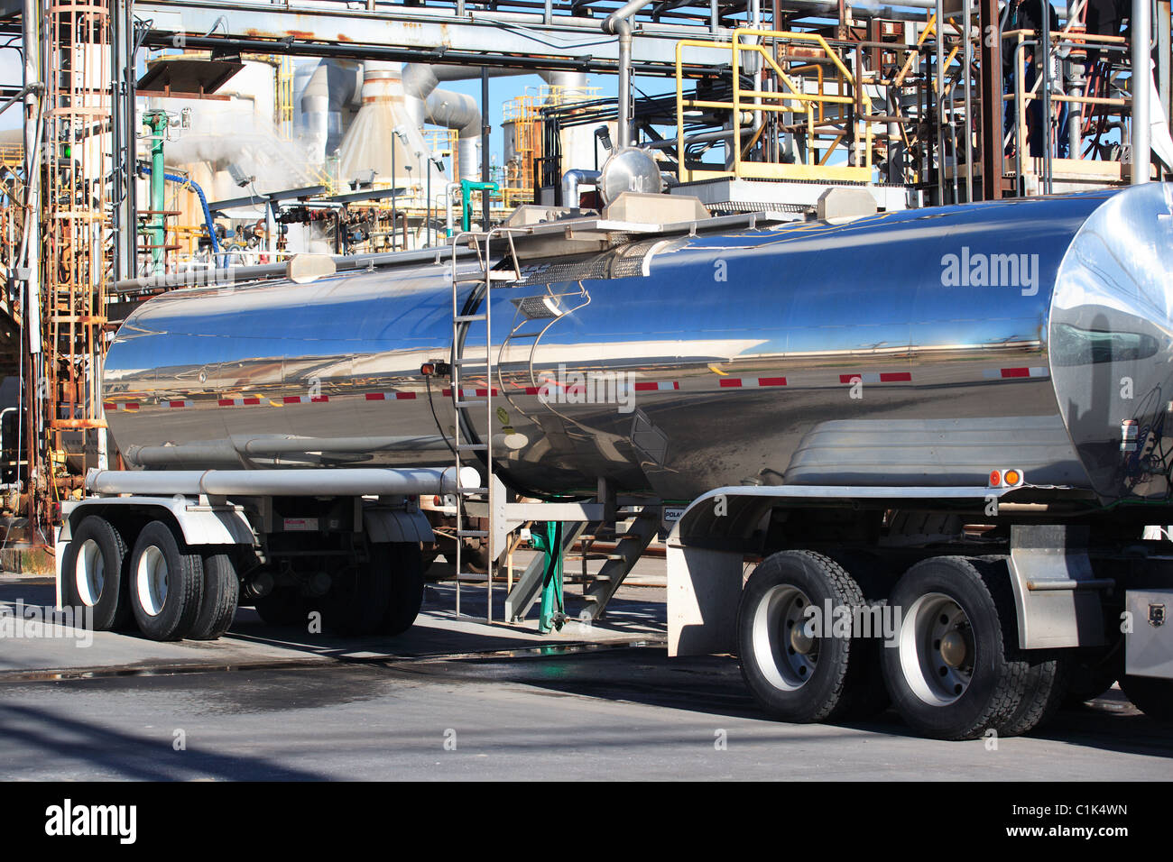 A tanker truck being filled at an industrial facility Stock Photo - Alamy