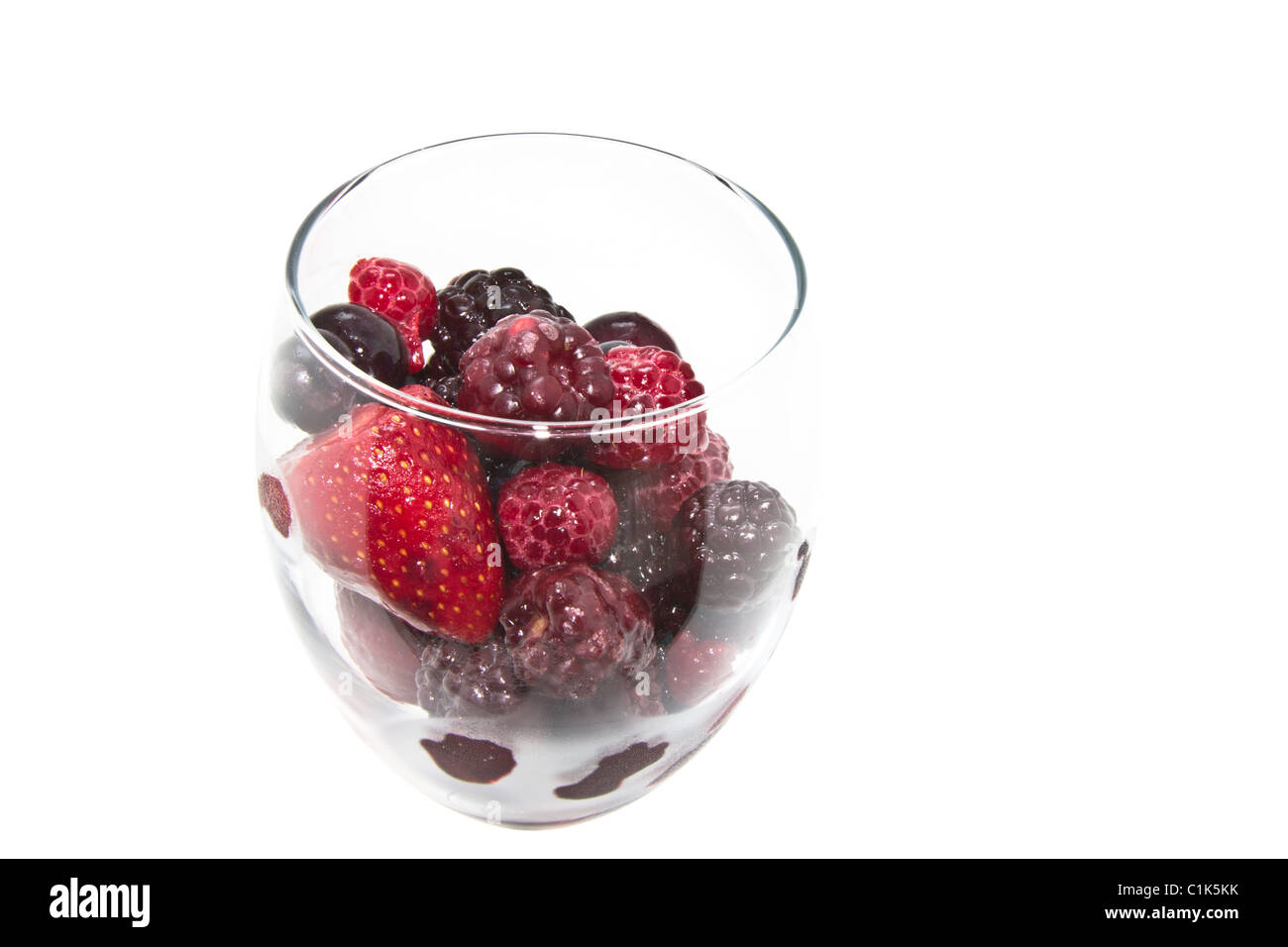 Raspberry, strawberry and blueberry served in a wine glass Stock Photo ...