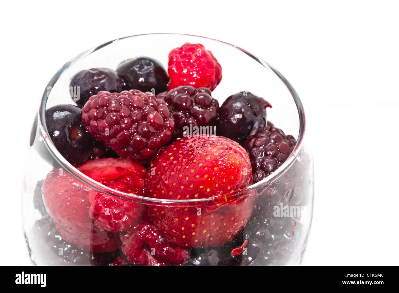 Raspberry, strawberry and blueberry served in a wine glass Stock Photo ...