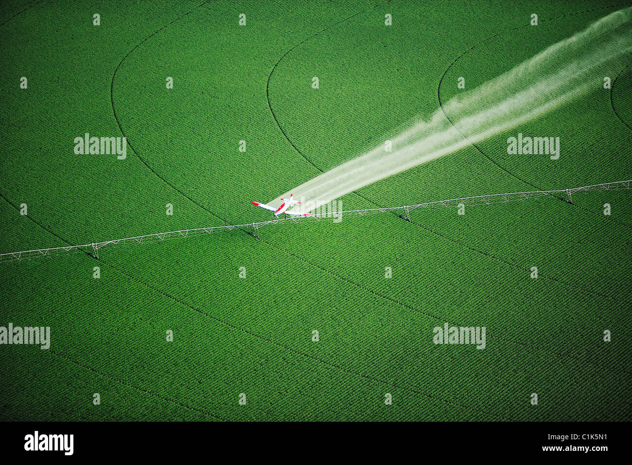 Aerial View of a crop duster spraying a farm field Stock Photo - Alamy