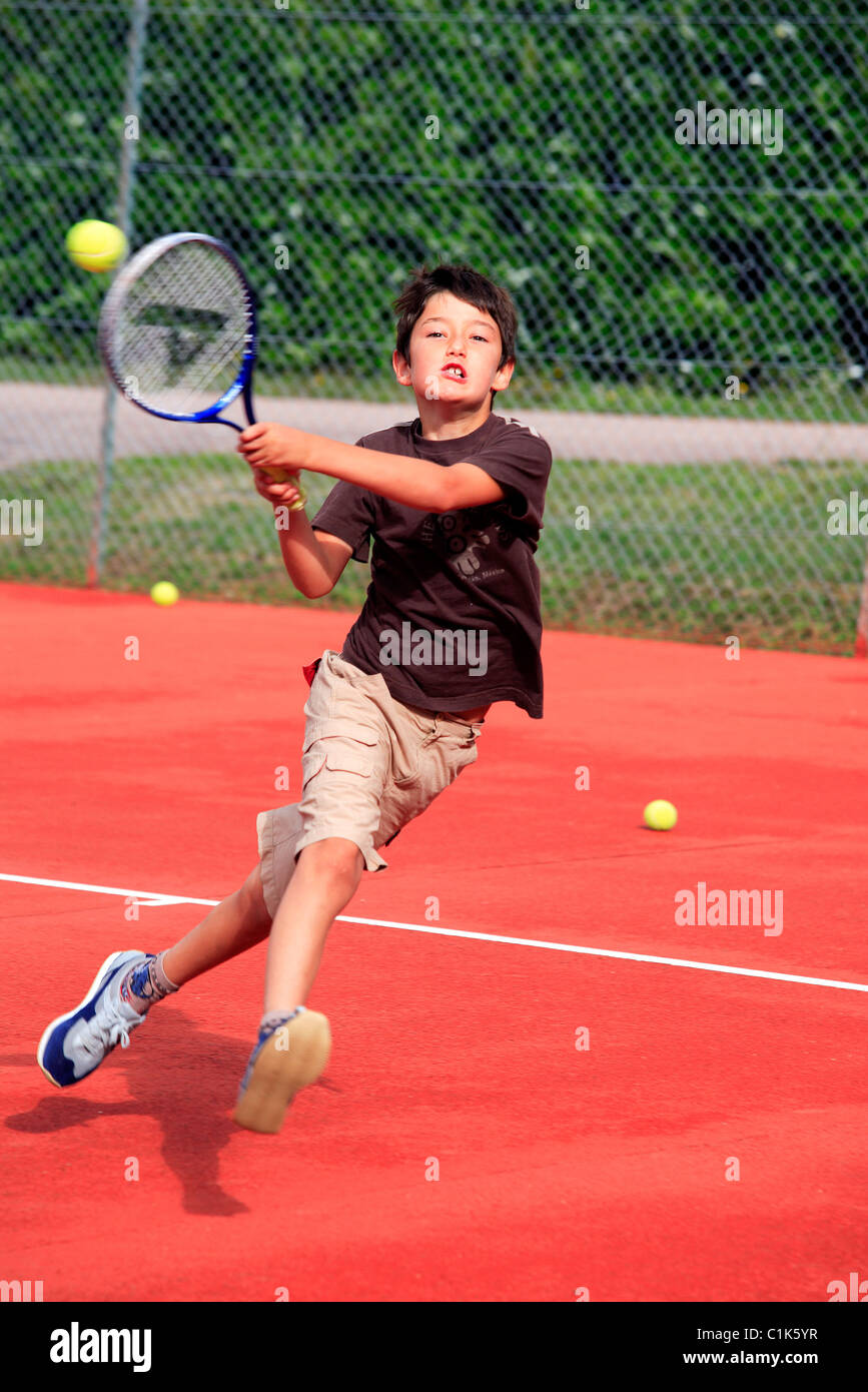 France, boy playing tennis Stock Photo - Alamy