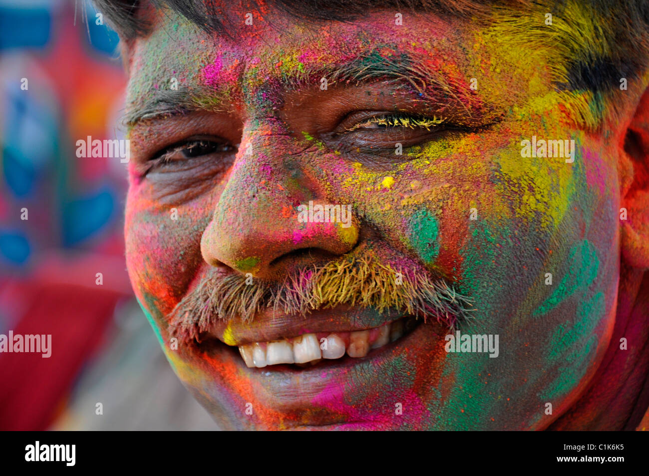Coloured face on the eve of Holi festival,India Stock Photo - Alamy