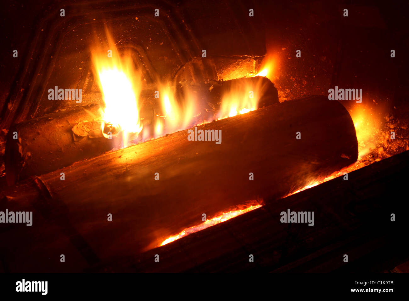 Fire in home fireplace Stock Photo - Alamy