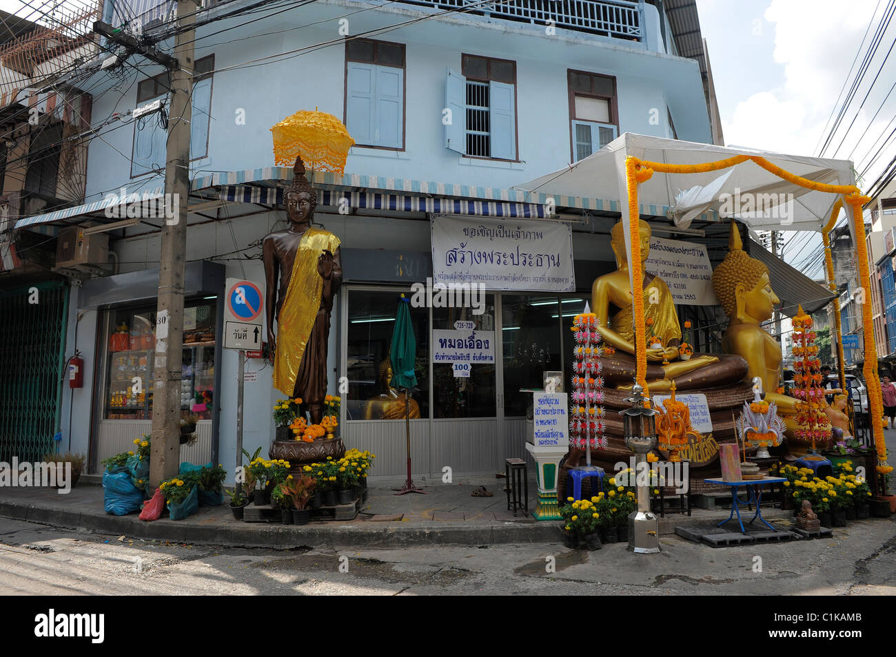 over the top home shrine,religious shop and temple, side street within ...