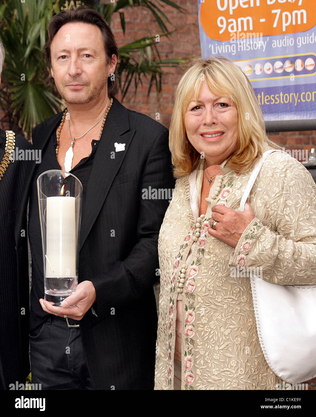 Julian and Cynthia Lennon holding a candle representing peace - part of ...