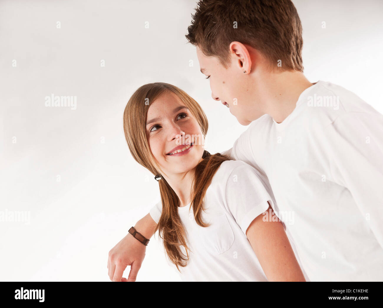 Two boys with arms around each other hi-res stock photography and ...