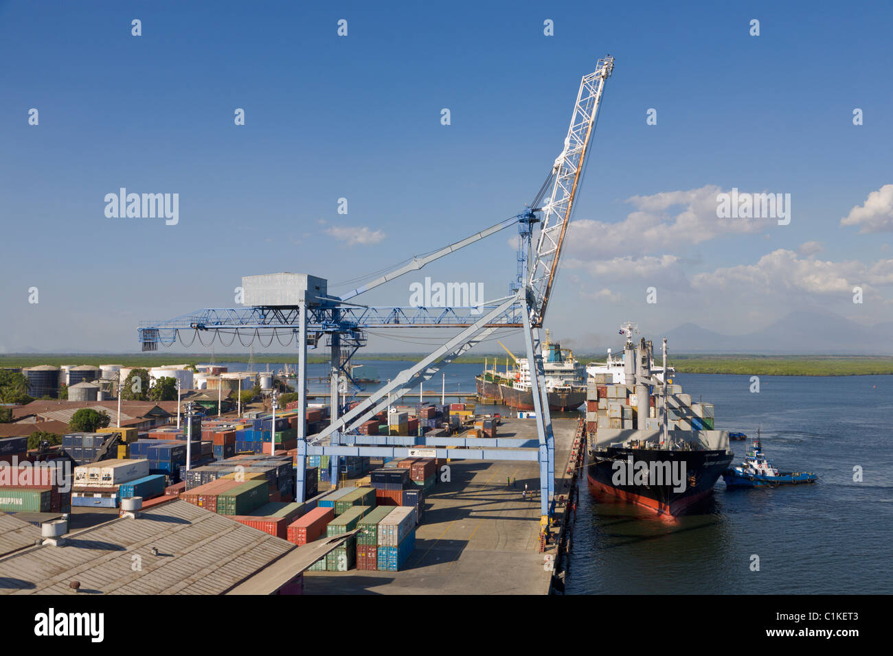 Container ship with tug arriving at the Port of Corinto, Nicaragua ...