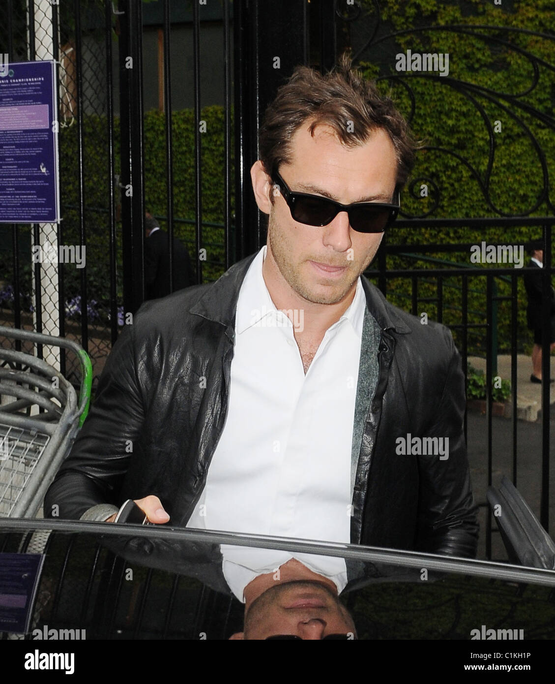 Jude Law leaving Wimbledon after watching Roger Federer beat Lu Yen ...