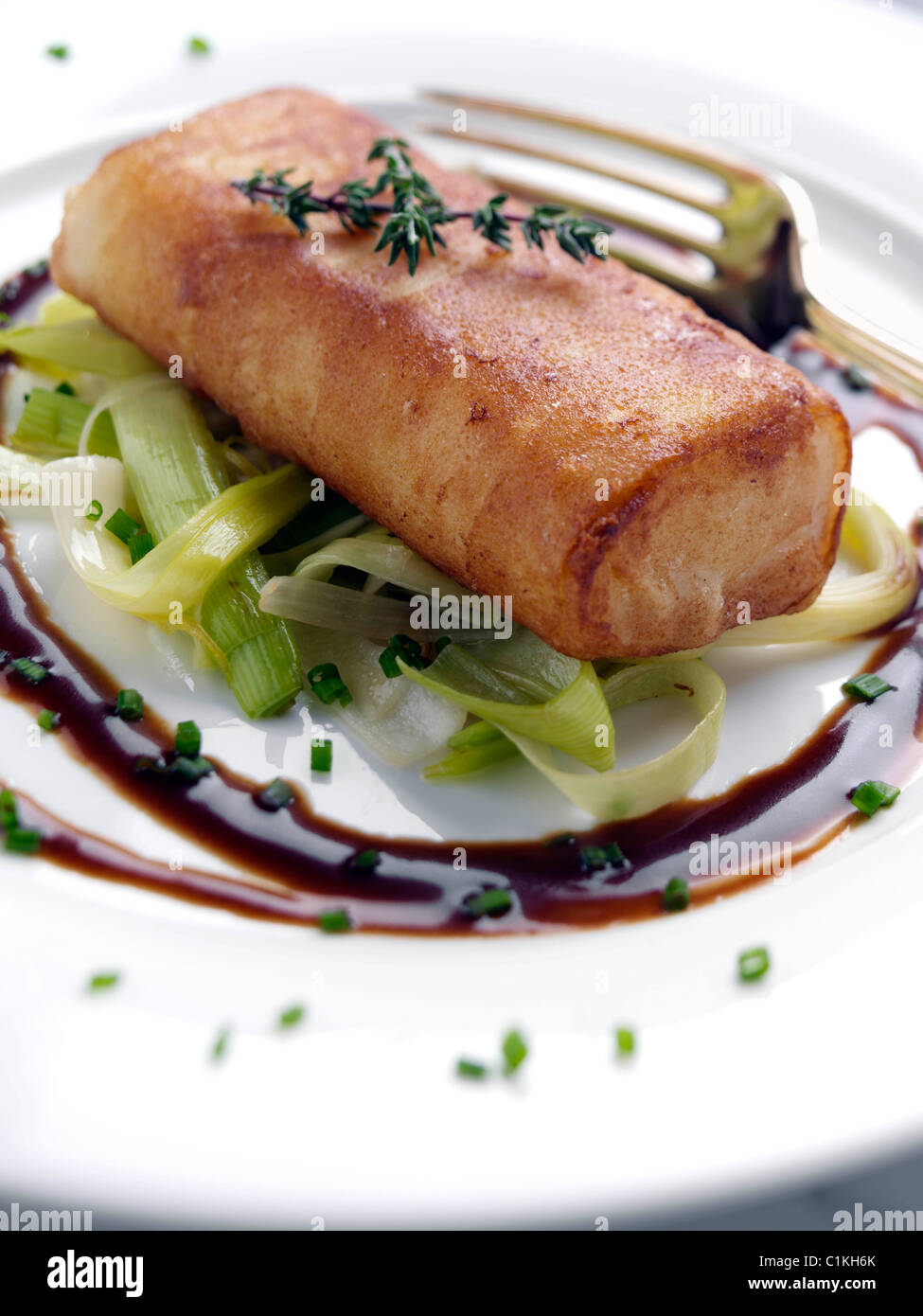Fish en paupiette with a bed of sauteed leeks and Barolo sauce main ...
