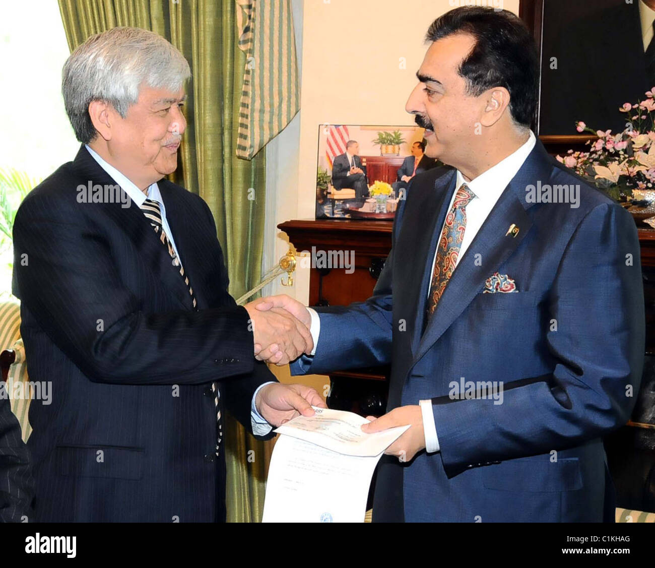 Prime Minister, Syed Yousuf Raza Gilani receives a cheque of one lac ...