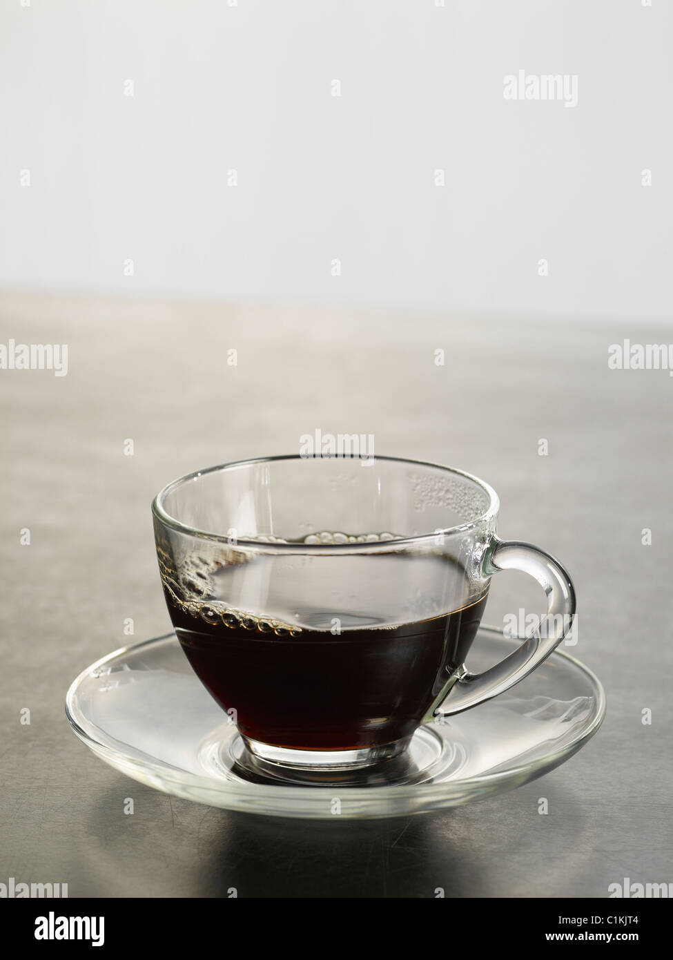 Glass Cup and Saucer with Coffee Stock Photo - Alamy