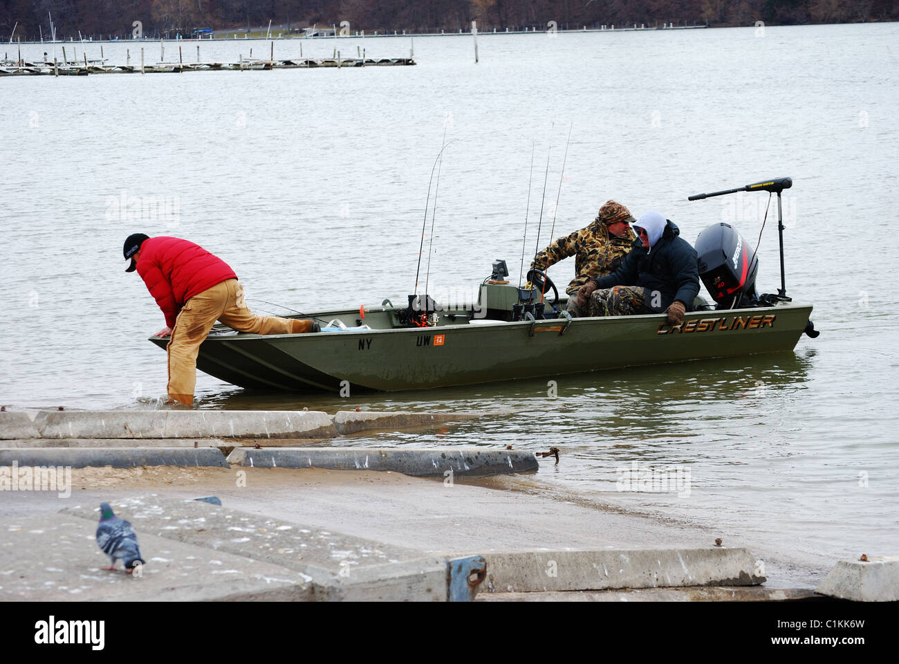 Men fresh water fishing from skiff Stock Photo - Alamy