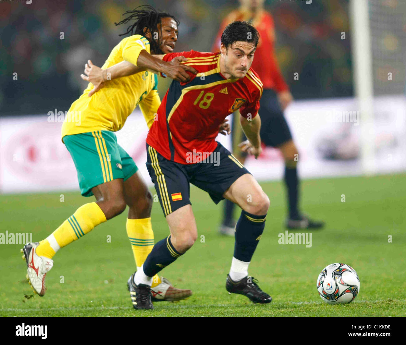 Albert Riera fights for possesion with Macbeth Sibaya during the FIFA Confederations Cup match ...
