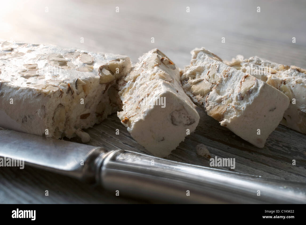 Torrone with Knife Stock Photo - Alamy
