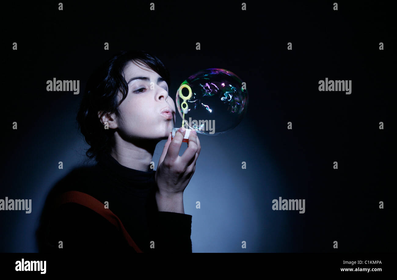 A girl making soap bubbles Stock Photo - Alamy