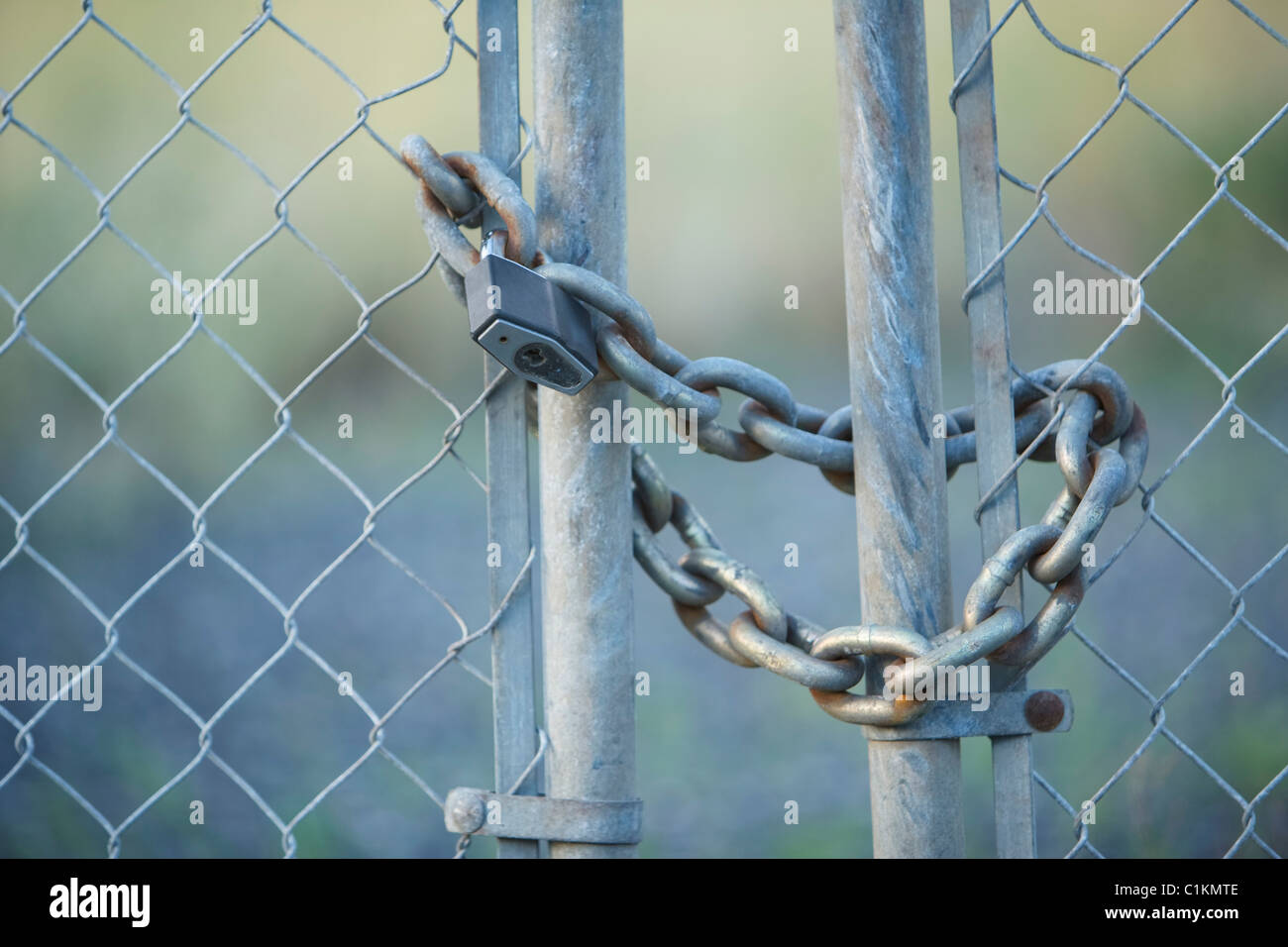 Chain and Lock on Fence Stock Photo - Alamy