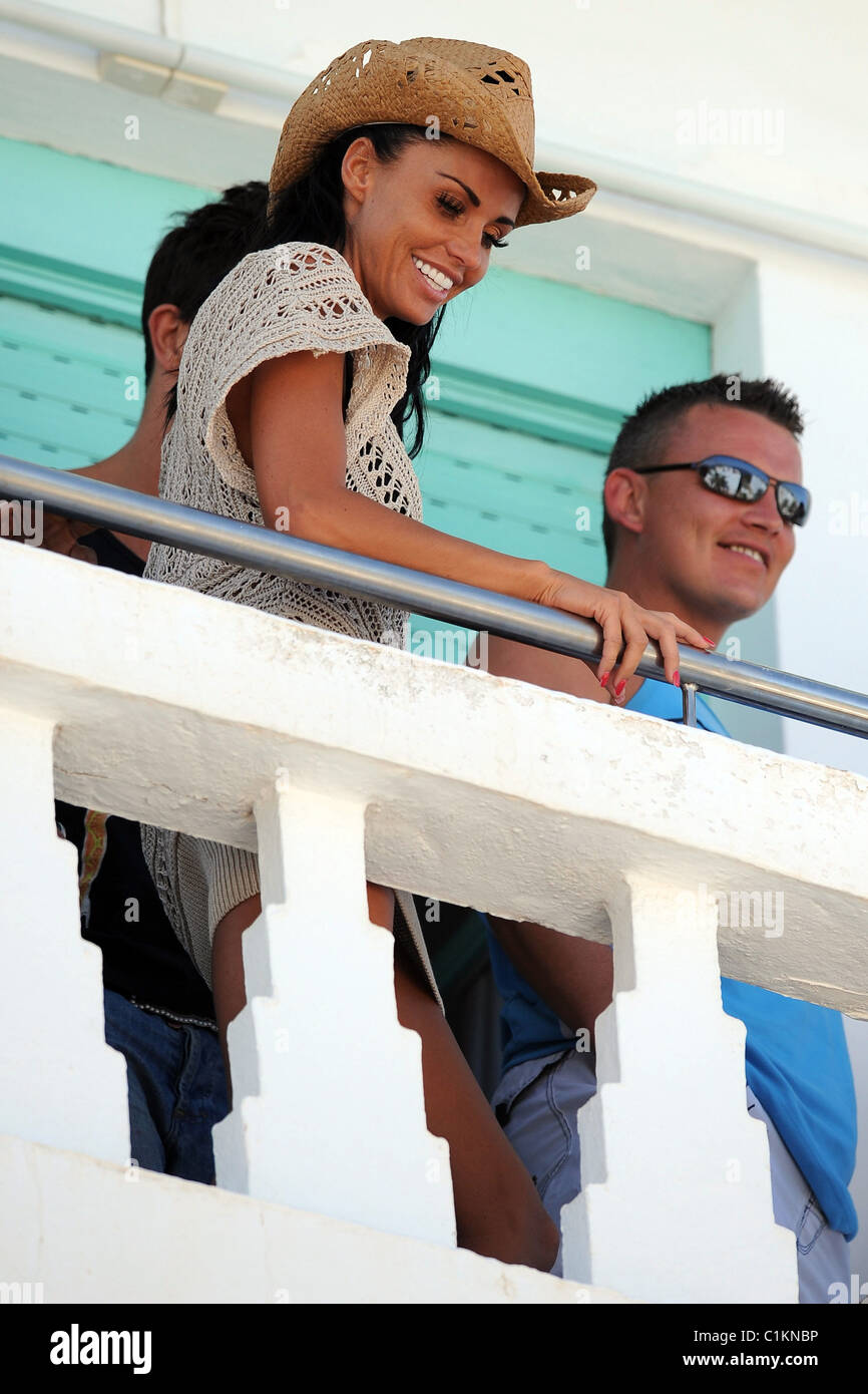 Katie Price looks out from the balcony of her hotel room Ibiza Town ...