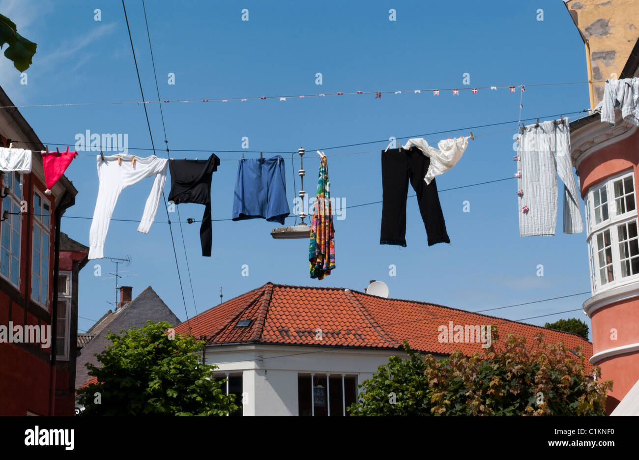 Laundry hanging on the street Stock Photo - Alamy