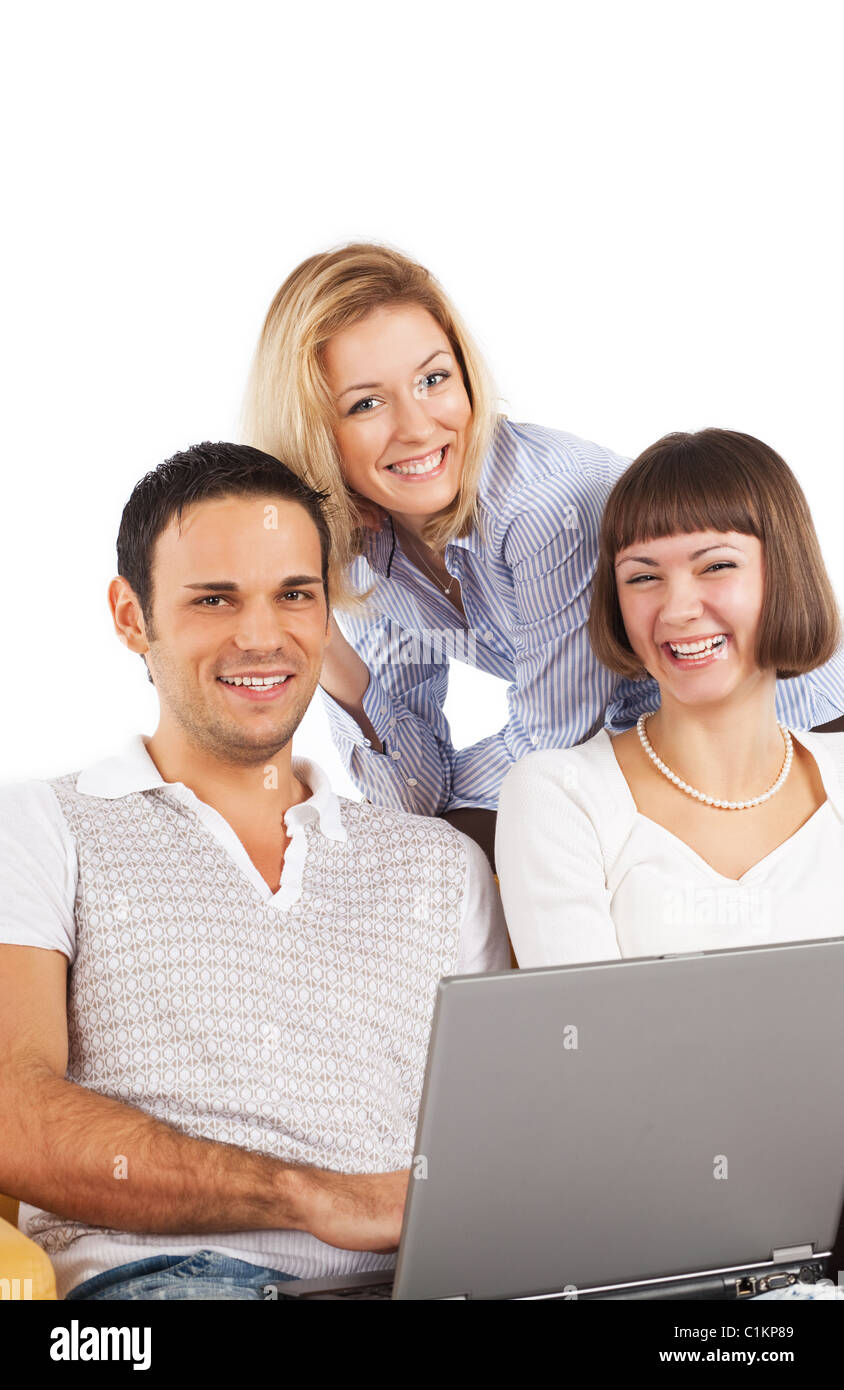 Group of three happy people sitting with a laptop computer Stock Photo ...