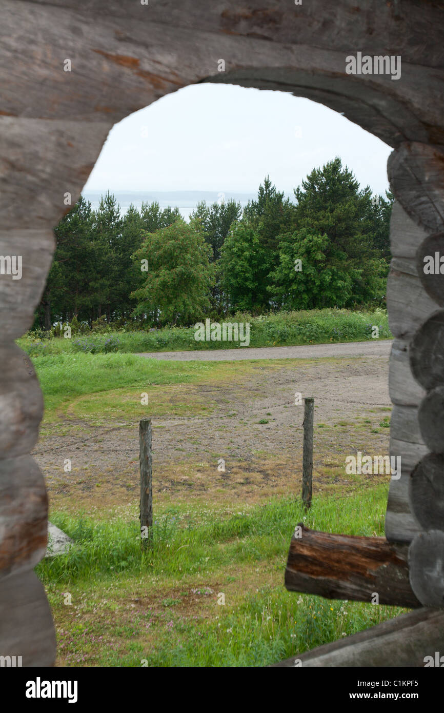 Type on green wood through arch from log Stock Photo - Alamy