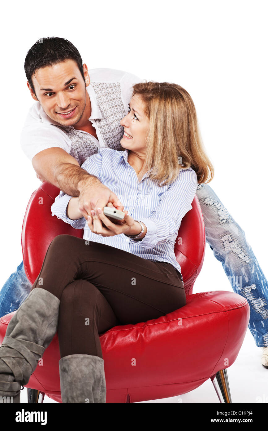Fighting for the tv remote hi-res stock photography and images - Alamy