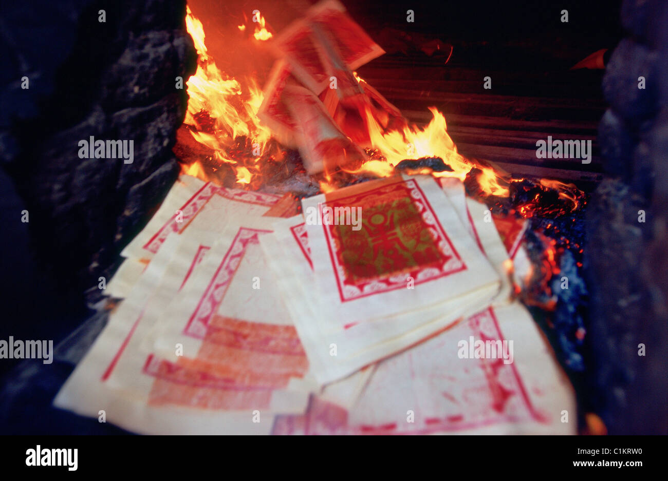 Taiwan, Taipei, Dalong street, Paper offerings burning in a furnace on ...