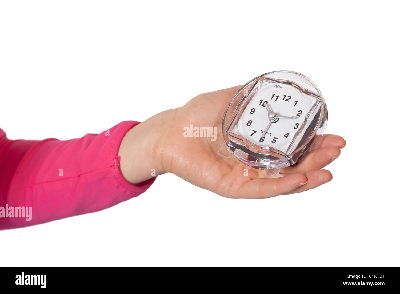 Hand holding alarm clock Stock Photo - Alamy