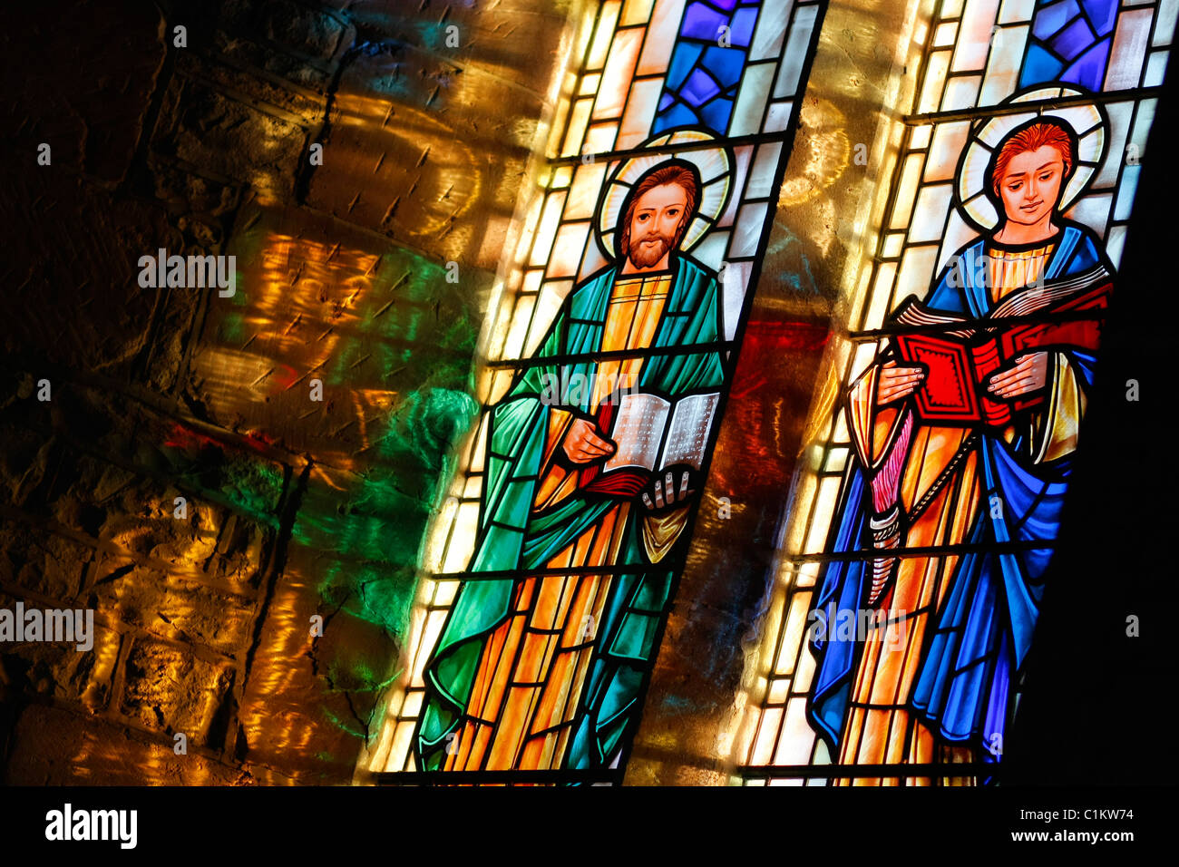 stained glass windows in a church depicting saints or holy men Stock ...