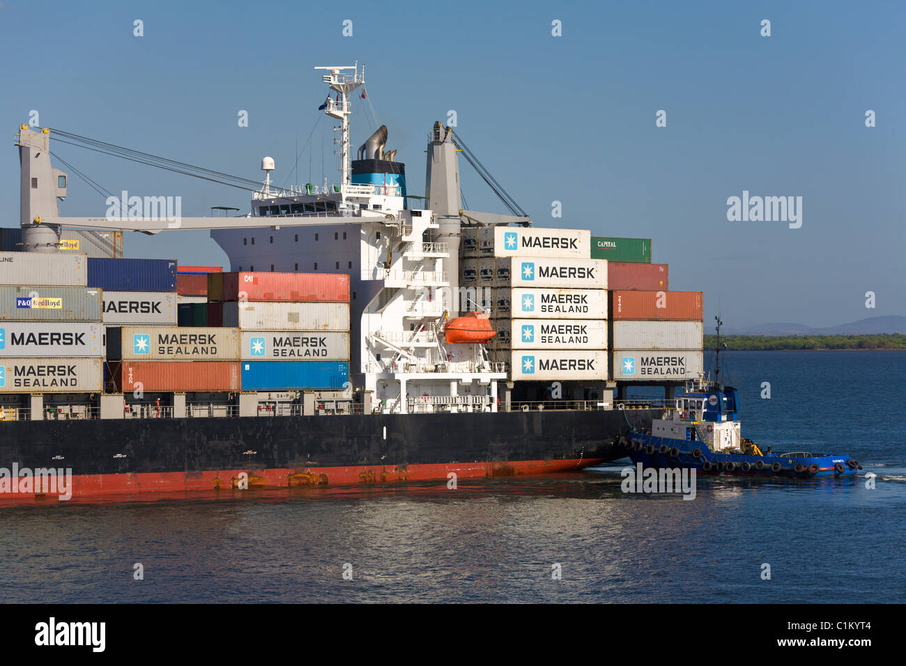 Container ship with tug arriving at the Port of Corinto, Nicaragua ...
