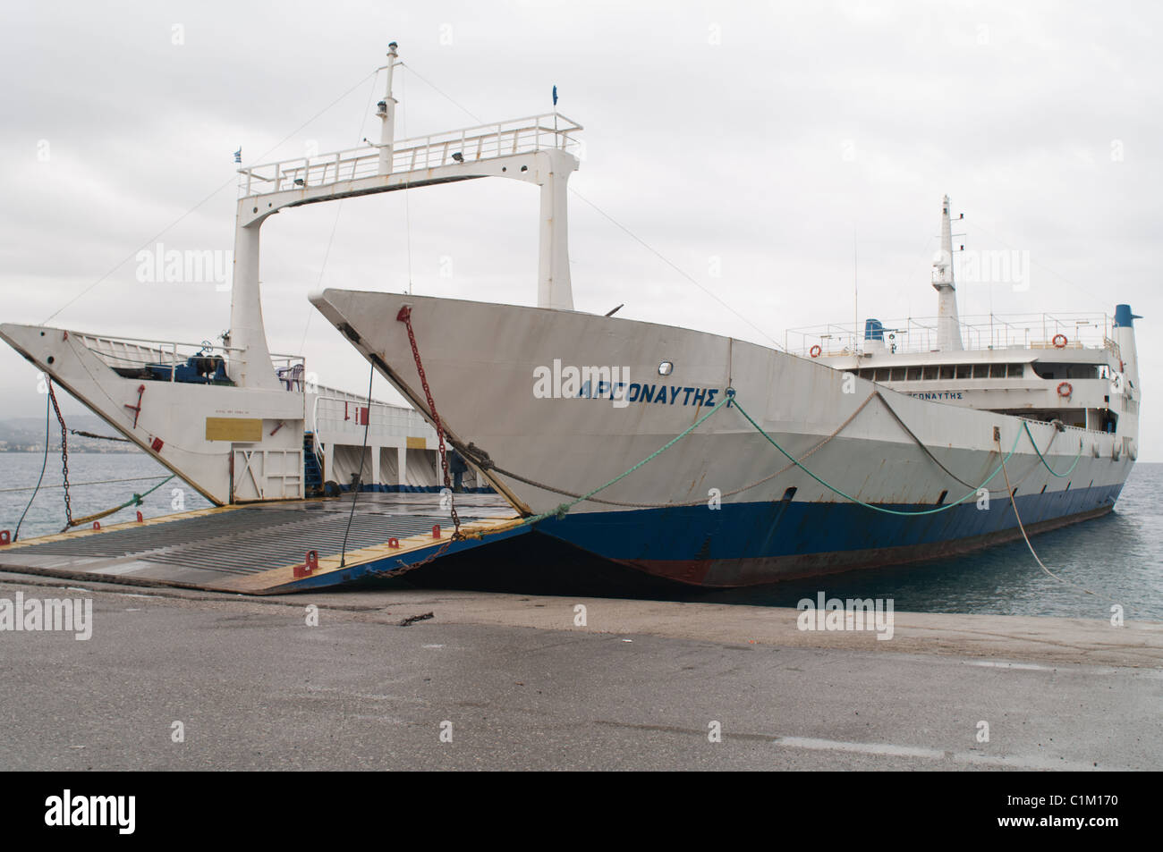 The ferries still load and unload as usual beneath the Rio-Antirion ...