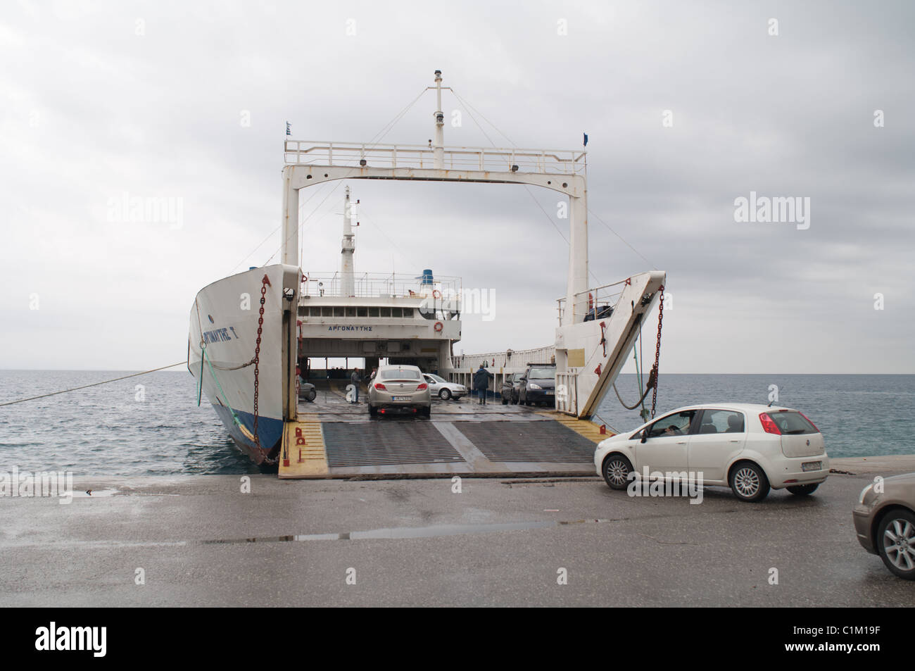 The ferries still load and unload as usual beneath the Rio-Antirion ...