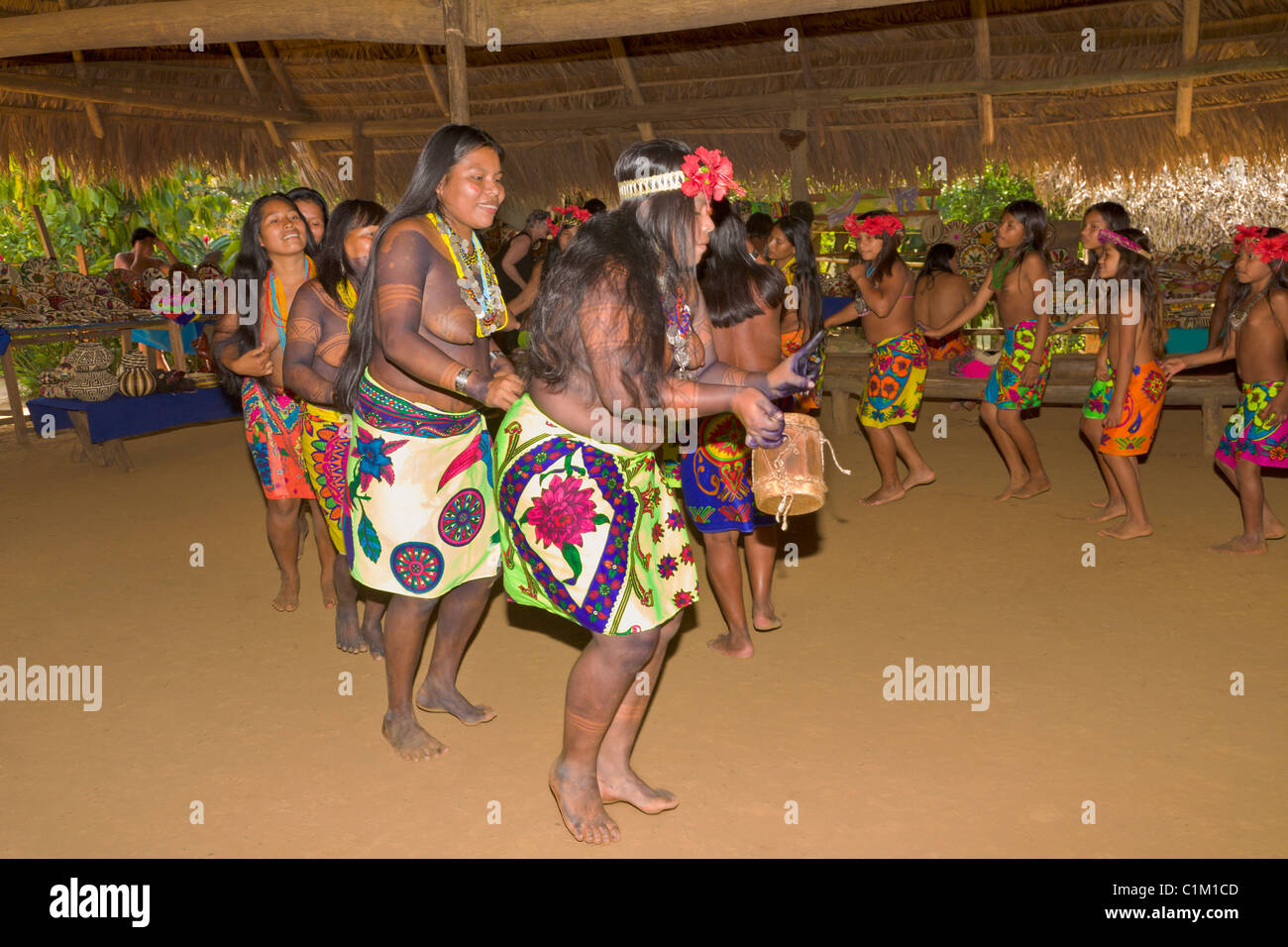 Woman of the Native Indian Embera Tribe dancing, Embera Village, Panama ...