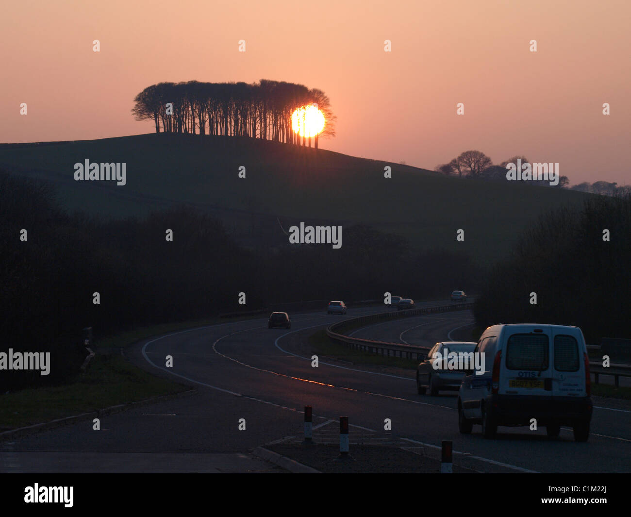 Sun setting behind hill hi-res stock photography and images - Alamy