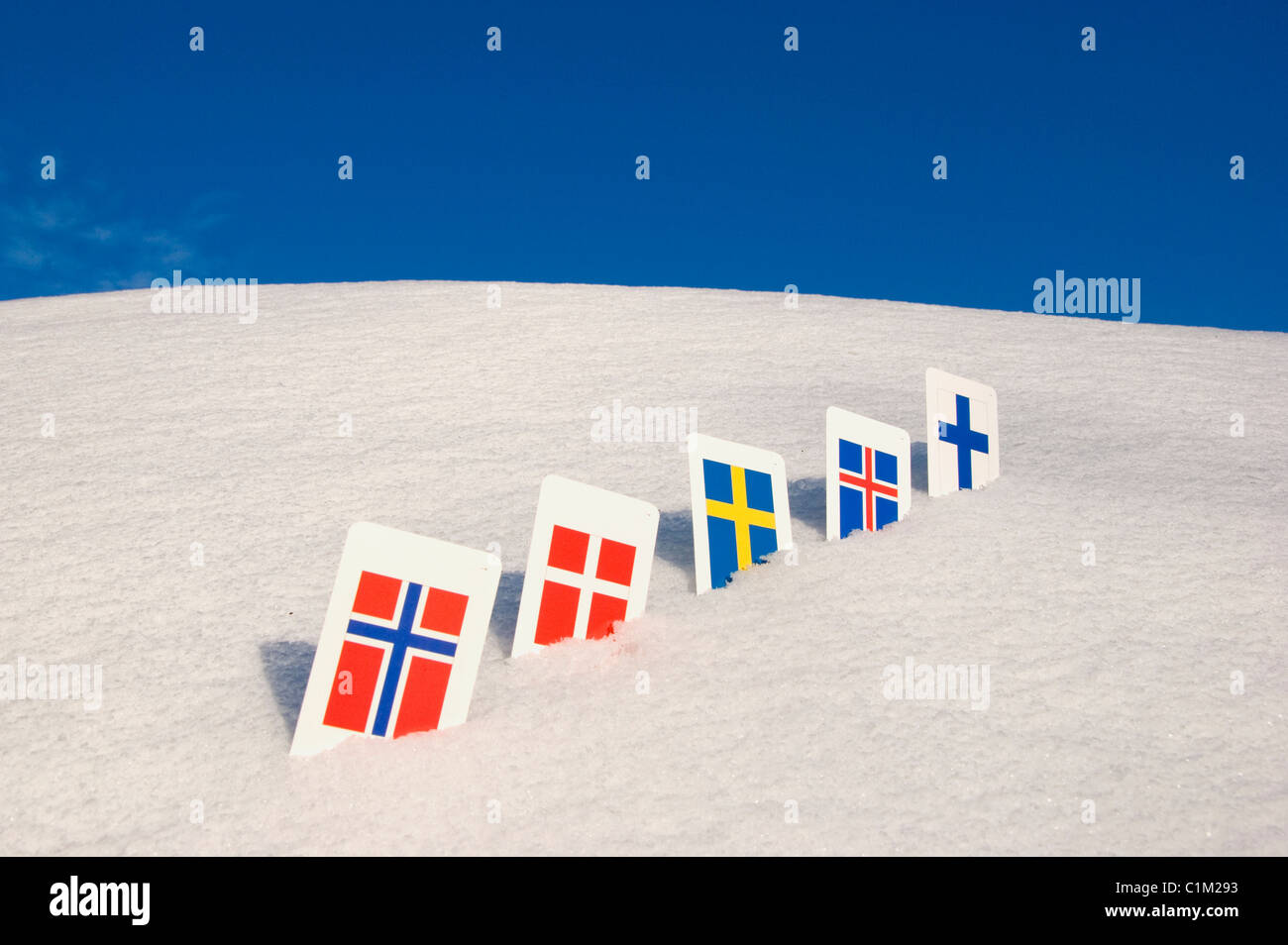 Nordic Europe country flag symbols on snow Stock Photo - Alamy