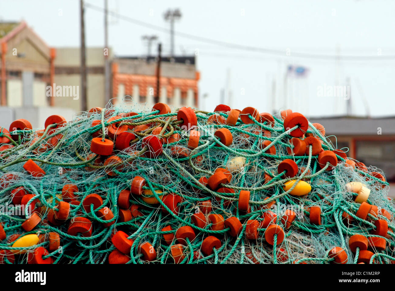 View of a pile of fishing net with plastic floaters on a harbor Stock ...