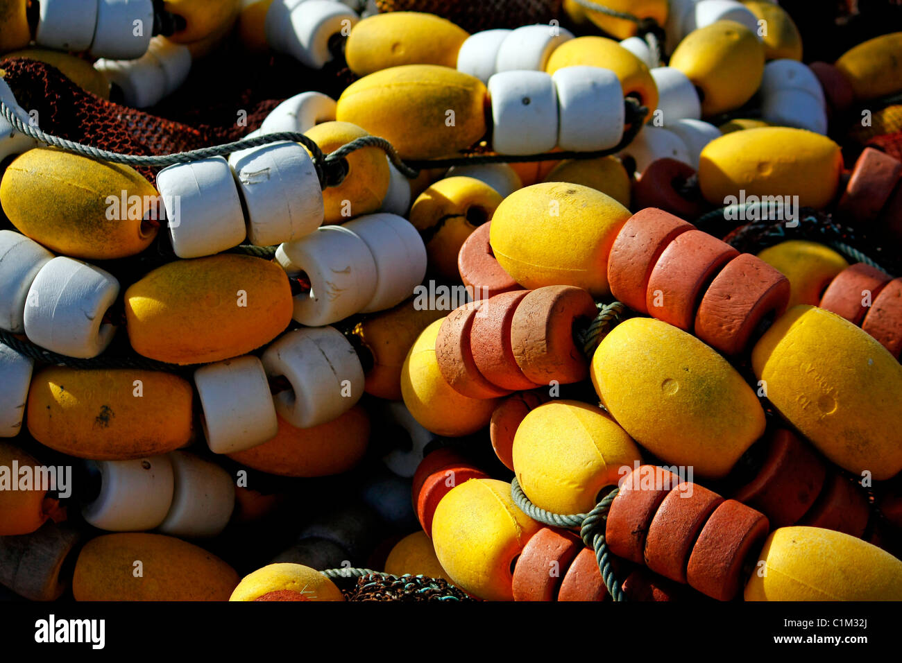 Close view of many fishing net floaters, piled on top of one another ...