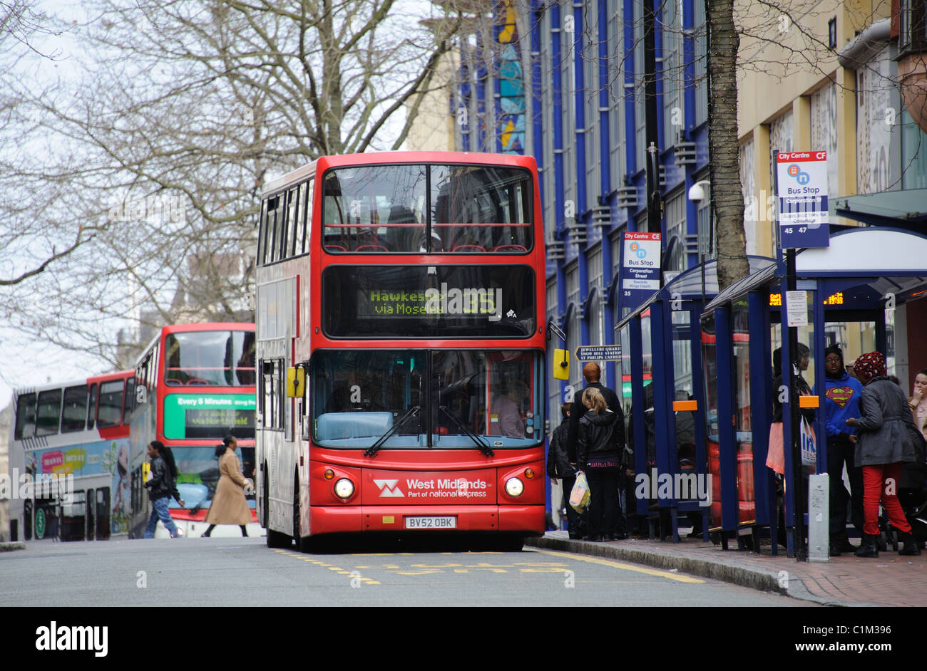 Bus stop and waiting passengers on Corporation Street in city centre ...