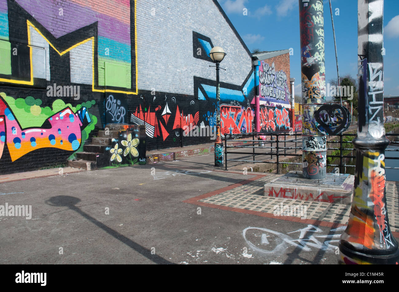 Graffiti covered walls and street furniture on the banks of the River ...