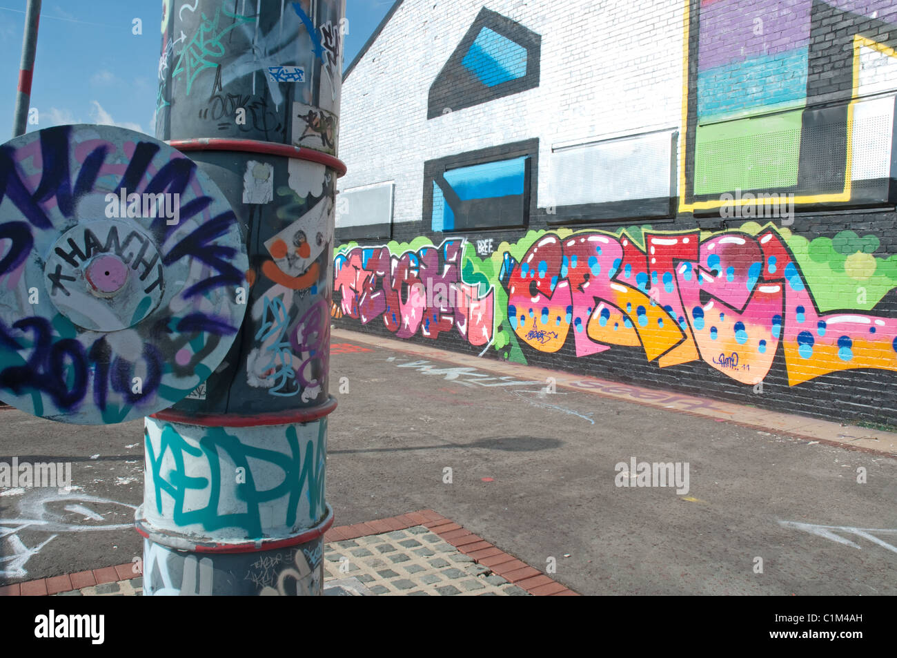 Graffiti covered wall and street furniture on the banks of the River ...