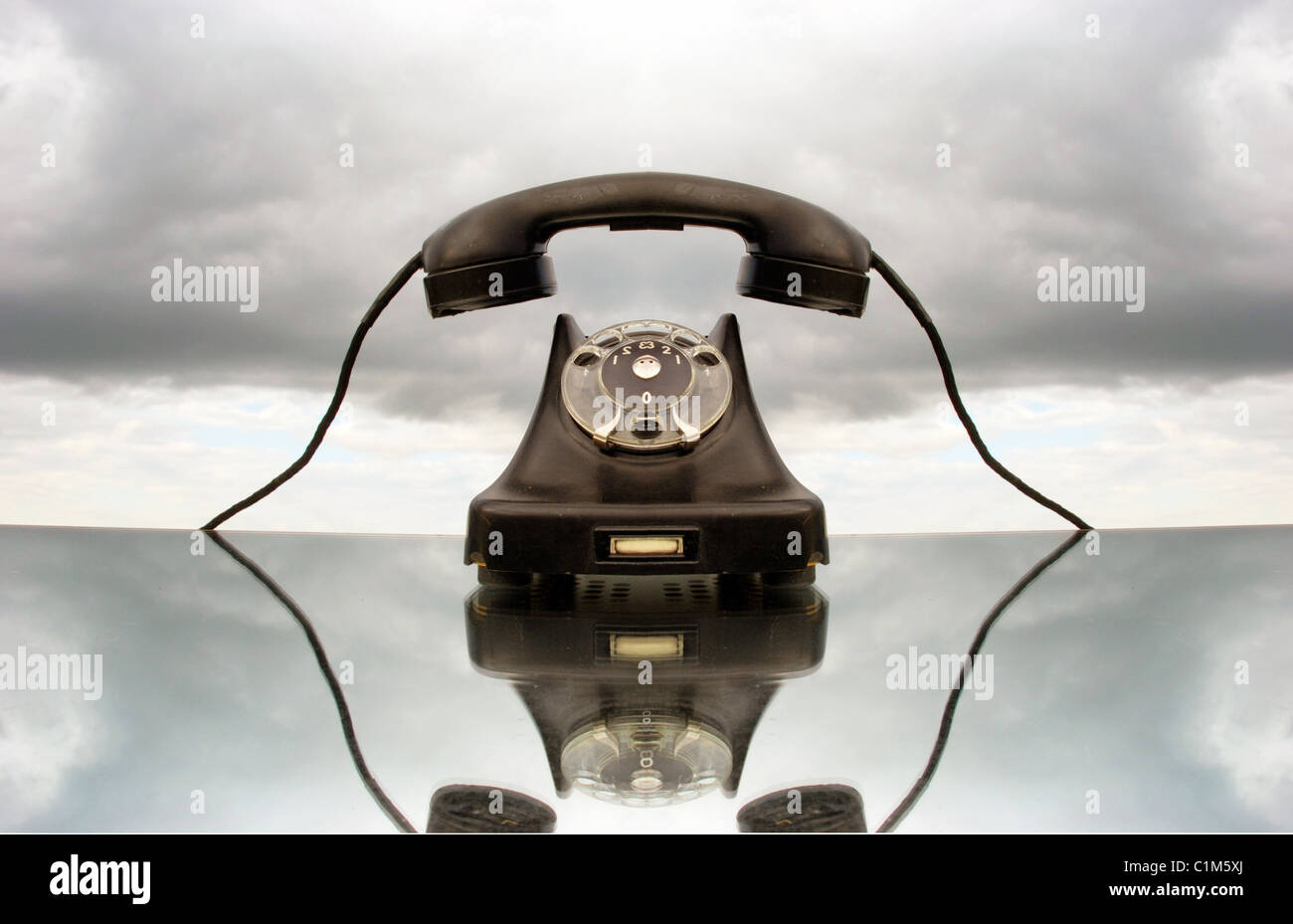 black retro phone symmetrical collage on mirror Stock Photo - Alamy