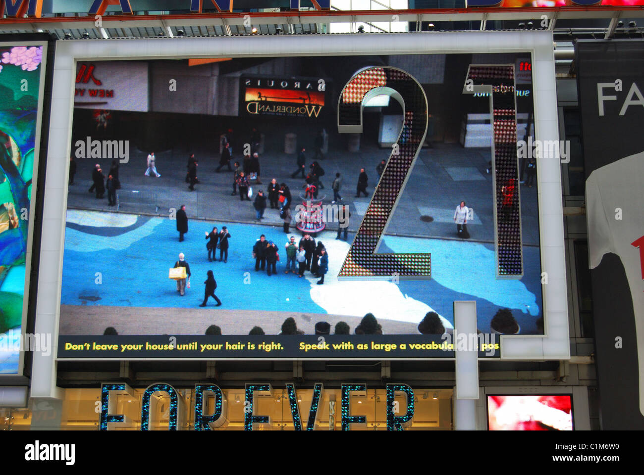 Large LCD screen showing people down in the street, Times Square ...
